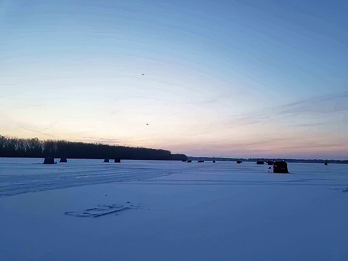 Winter transforms East Harbor into an ice fishing village where the hardiest Ohioans prove that fishing season never truly ends.