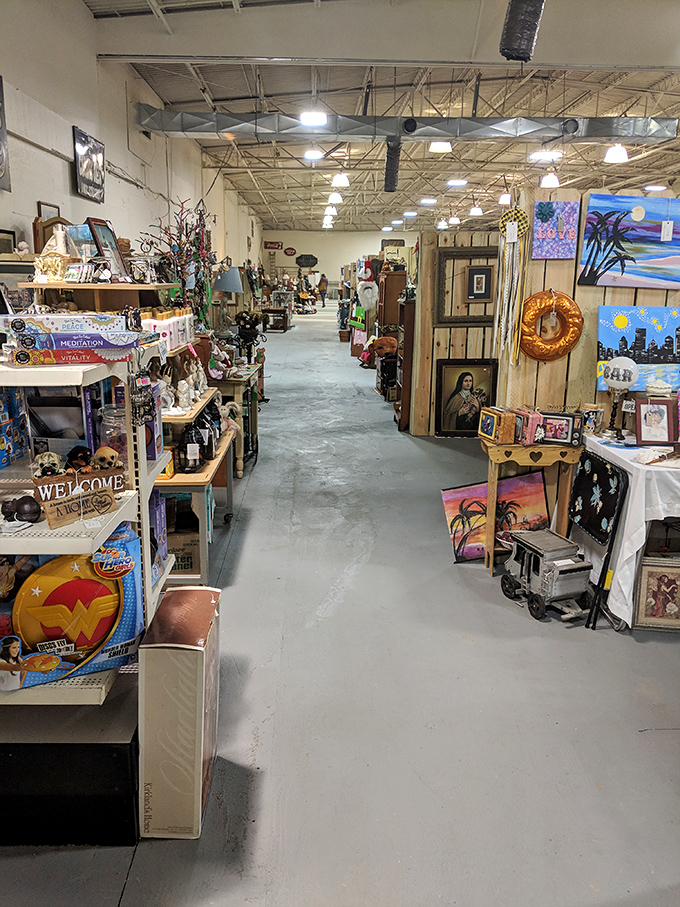 Wide aisles and wooden booths create the perfect treasure-hunting environment. Spot that Wonder Woman shield? Someone's childhood hero awaits a new adventure.