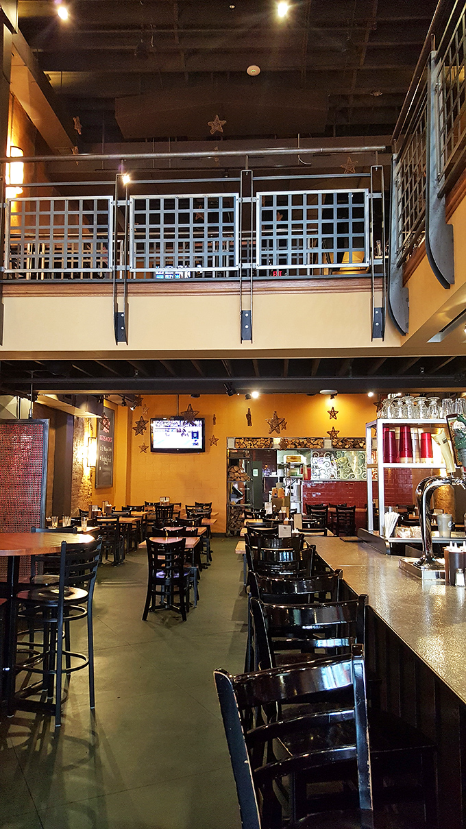 Two-story dining with industrial charm. Those decorative stars aren't just for show – they're guiding you to barbecue nirvana.