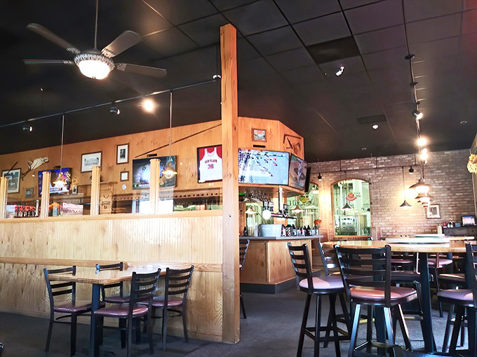 Wooden dividers and cozy booths create those perfect conversation nooks where good food leads to great talks and "just one more beer."