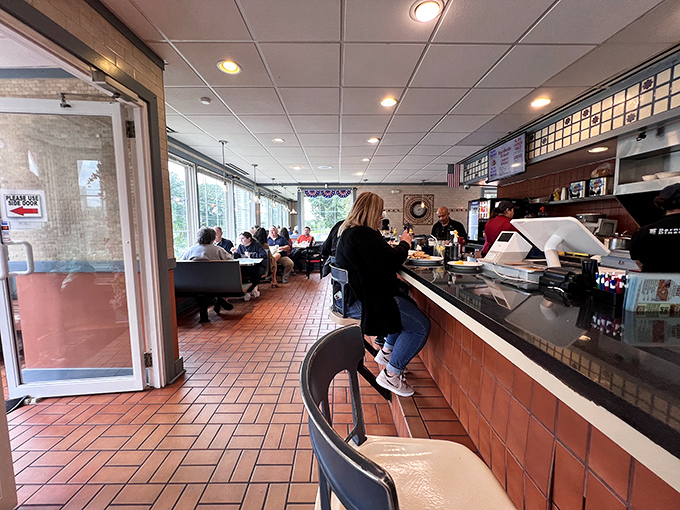 Morning light streams through windows, illuminating the terra cotta floor where countless breakfast dreams have been fulfilled. 