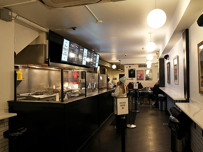 Where the magic happens &ndash; order counter, open kitchen, and the promise of imminent satisfaction. Anticipation builds with every step forward.