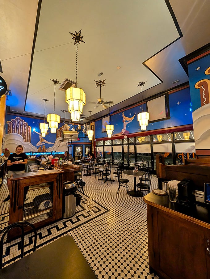 The ceiling murals alone are worth the visit—like dining inside a dream sequence from a Wes Anderson film.