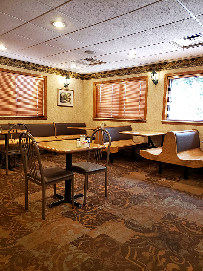 Cozy booths, wood paneling, and warm lighting create the perfect backdrop for conversations that flow as easily as the coffee refills.