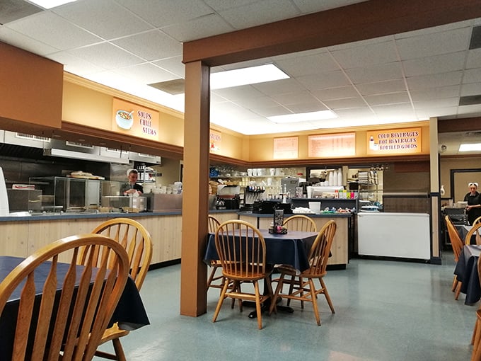 Simple wooden chairs, blue tablecloths, and an open kitchen where culinary magic happens without smoke, mirrors, or molecular gastronomy.