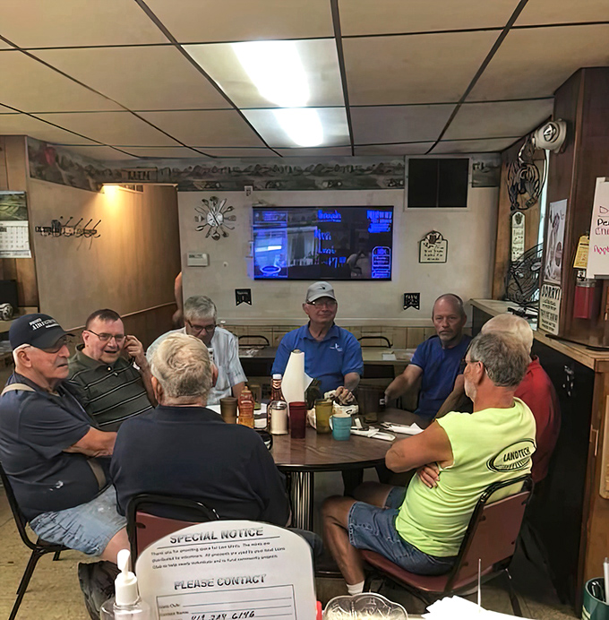 The regulars' table at Midway isn't just furniture—it's a community gathering spot where the morning news is discussed, debated, and occasionally improved upon.
