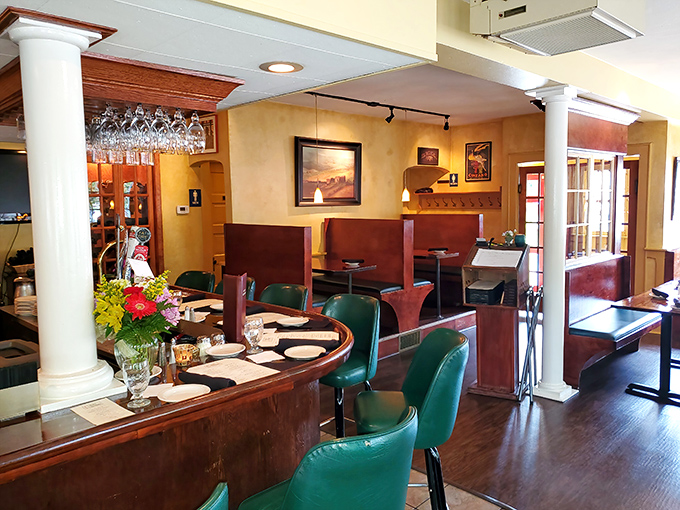 The dining room's warm wood tones and classic columns create that perfect "fancy but not intimidating" vibe where memories are made between bites.