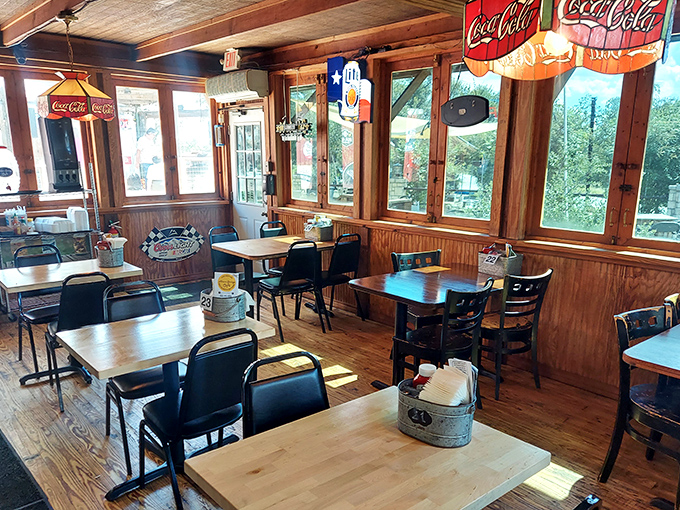 Sunlight streams through windows illuminating simple wooden tables where burger memories are made. No Instagram lighting needed—this place is naturally photogenic.