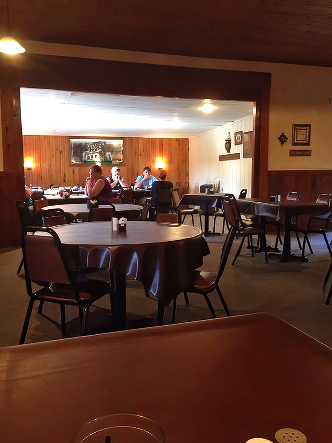 Simple tables, practical chairs, and wood-paneled warmth&mdash;a dining room that says "the food is the star here" without saying a word.