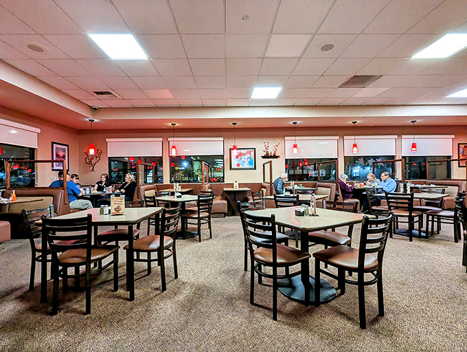 Evening at J & M's brings a warm glow to the dining room, where tables await families and friends gathering to share stories over plates of comfort.