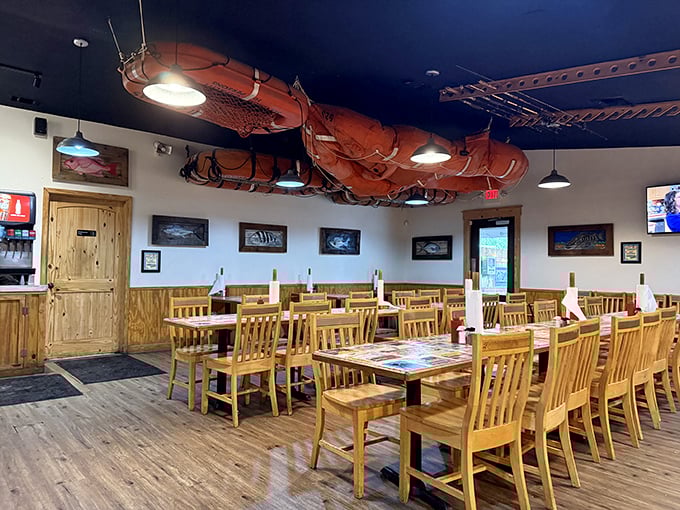 Fishing nets suspended from the ceiling &ndash; because nothing says "your seafood was swimming this morning" quite like nautical d&eacute;cor that means business.