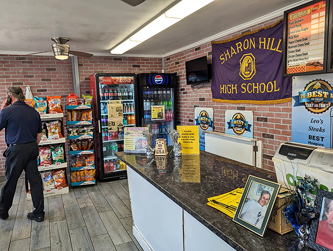 Local pride on display with the Sharon Hill High School banner. Every great sandwich shop becomes part of its community.