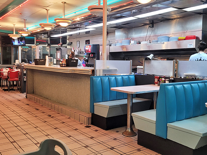 Rows of booths where strangers become friends over shared appreciation for food done absolutely, undeniably right.