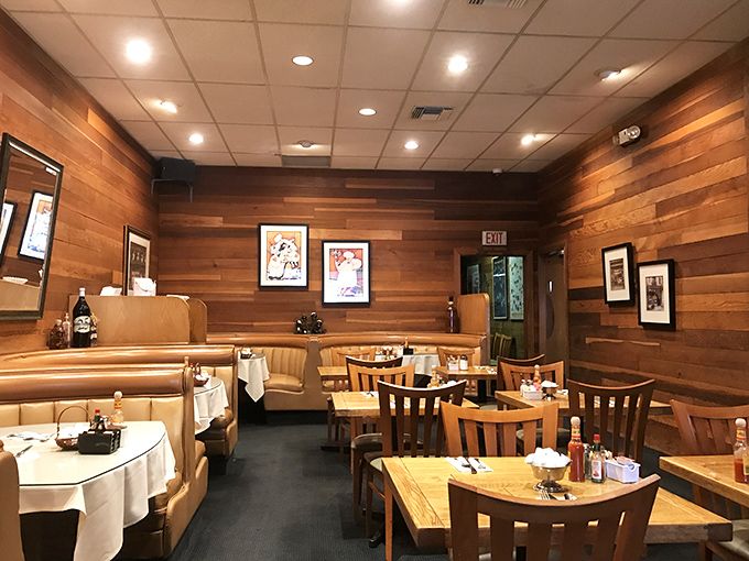 Wood-paneled walls lined with decorative plates create the perfect backdrop for conversations that flow as smoothly as their coffee refills.