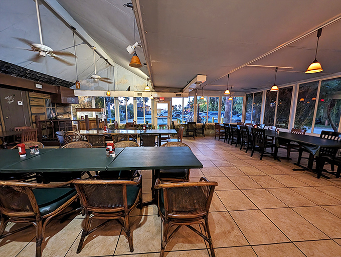 The dining room's expansive windows invite Lake Jesup's natural beauty to be your dinner companion. No reservation needed for this view.