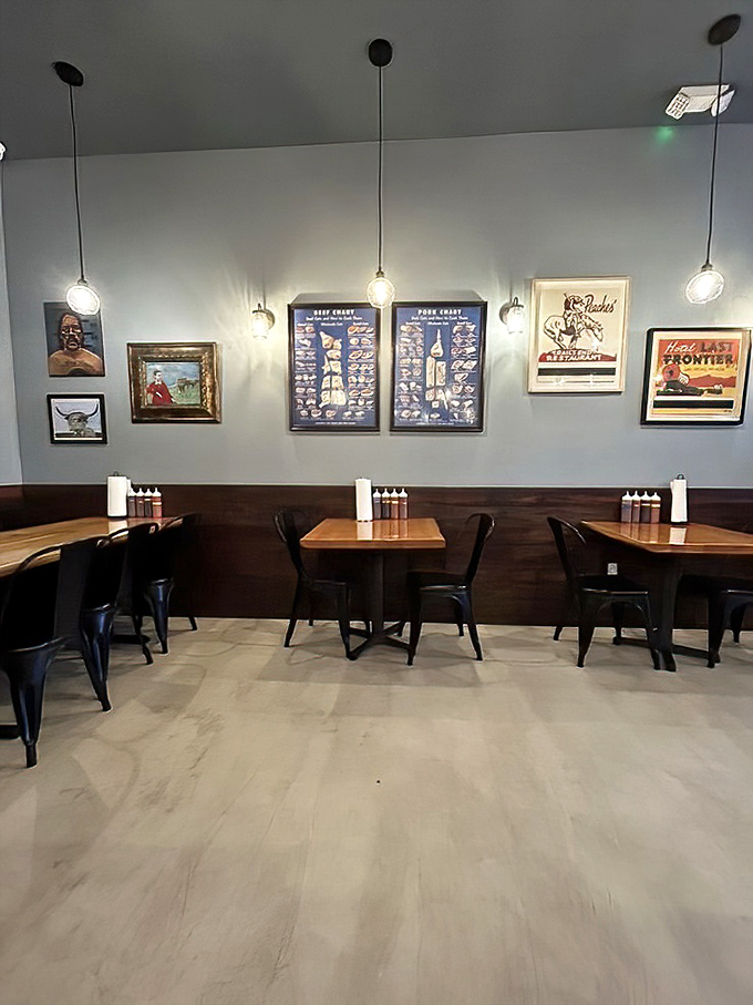 Modern industrial meets barbecue joint – pendant lights illuminate meat charts on the wall, a roadmap to delicious decisions.