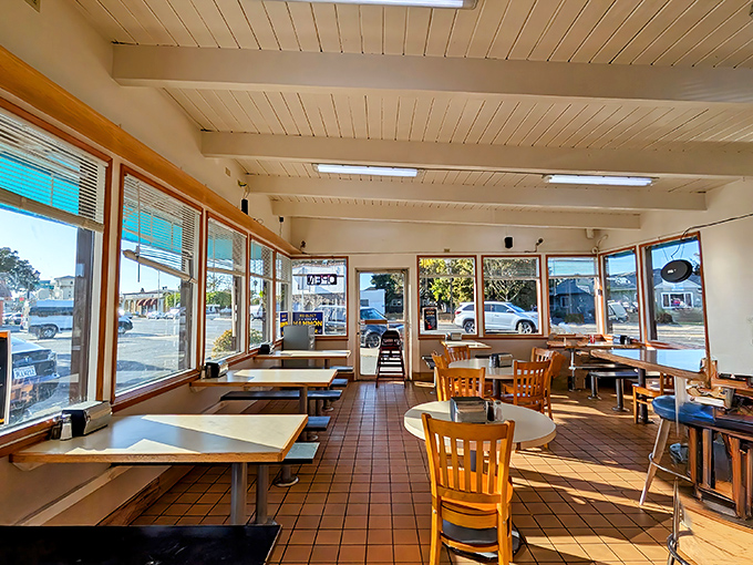 The dining room's wraparound windows create a fishbowl effect, except you're the one watching the world while enjoying your meal.