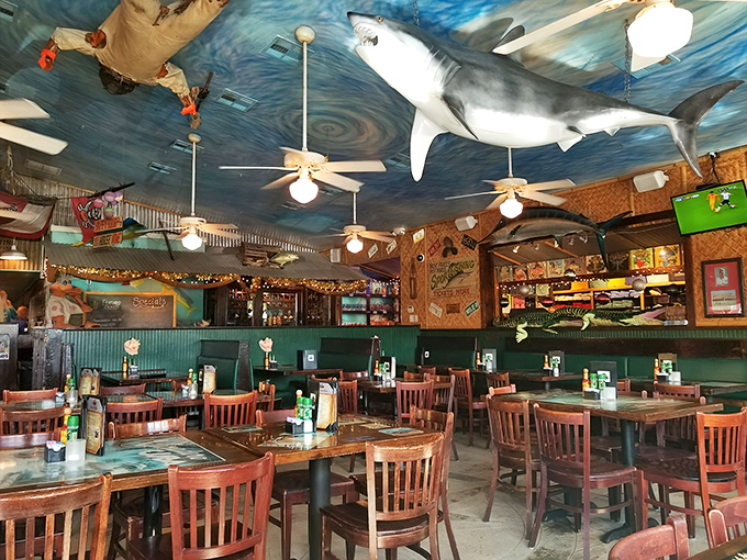 A ceiling painted like ocean waves and a shark keeping watch overhead. This dining room feels like you've stumbled into the world's most delicious aquarium.