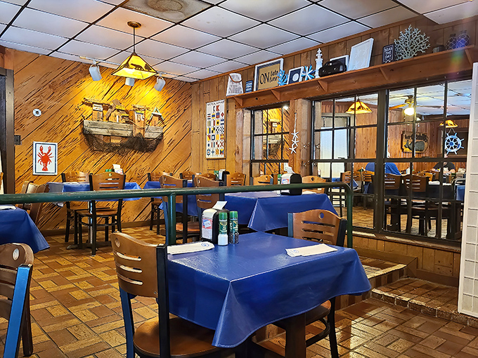 Blue tablecloths against wooden walls create that "secret seafood spot" atmosphere that makes you feel like an insider just for being there.