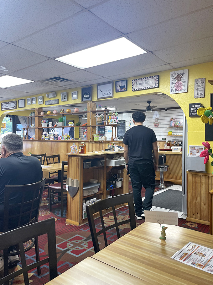 The pass-through to the kitchen offers a glimpse of breakfast alchemy in action. Where waffle dreams become reality.