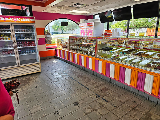 Rainbow stripes and donut displays create a wonderland where calories don't count and happiness is guaranteed.
