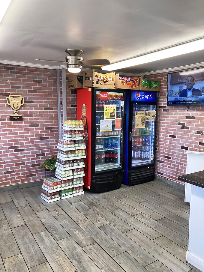 The beverage corner &ndash; where cold drinks await their sandwich soulmates. Brick walls and wood floors create the perfect stage for culinary magic.