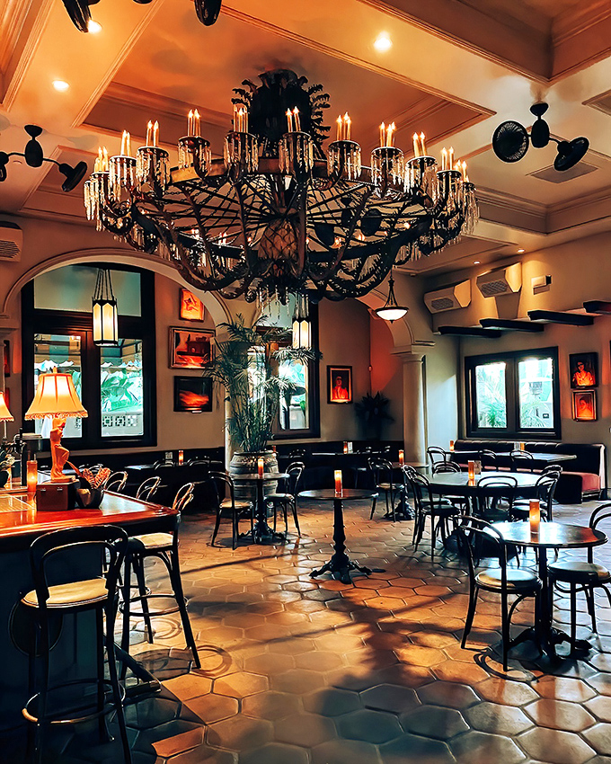 That chandelier isn't just lighting&mdash;it's jewelry for the ceiling. The warm glow makes everyone look like they've just returned from a Caribbean vacation.