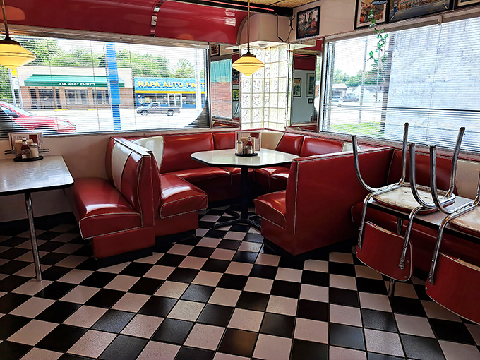 The corner booth—prime real estate for watching the diner's morning choreography while plotting which pie you'll have for dessert.