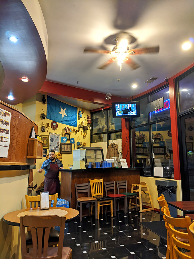 The Somali flag and cultural artifacts transform a simple dining room into a genuine experience&mdash;dinner and a geography lesson in one.