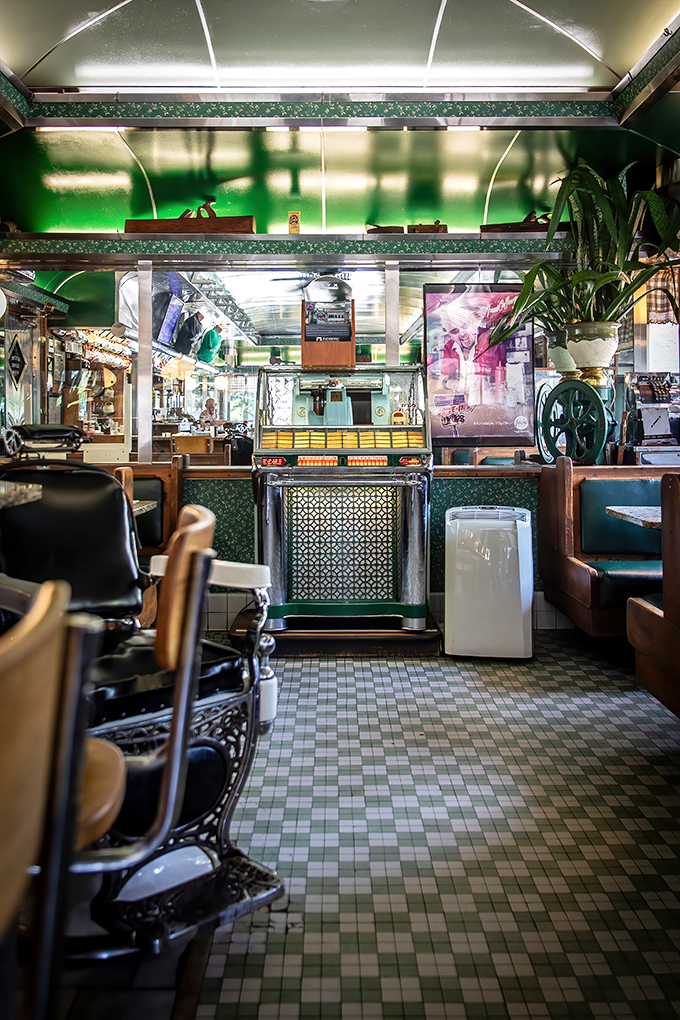The diner's interior glows with that distinctive green charm&mdash;like being inside a perfectly preserved time capsule where calories don't count.