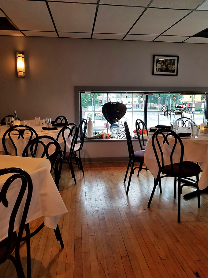 Another dining room view showcases the warm wooden floors and elegant simplicity that makes Fenicci's feel like dining in someone's well-appointed home.
