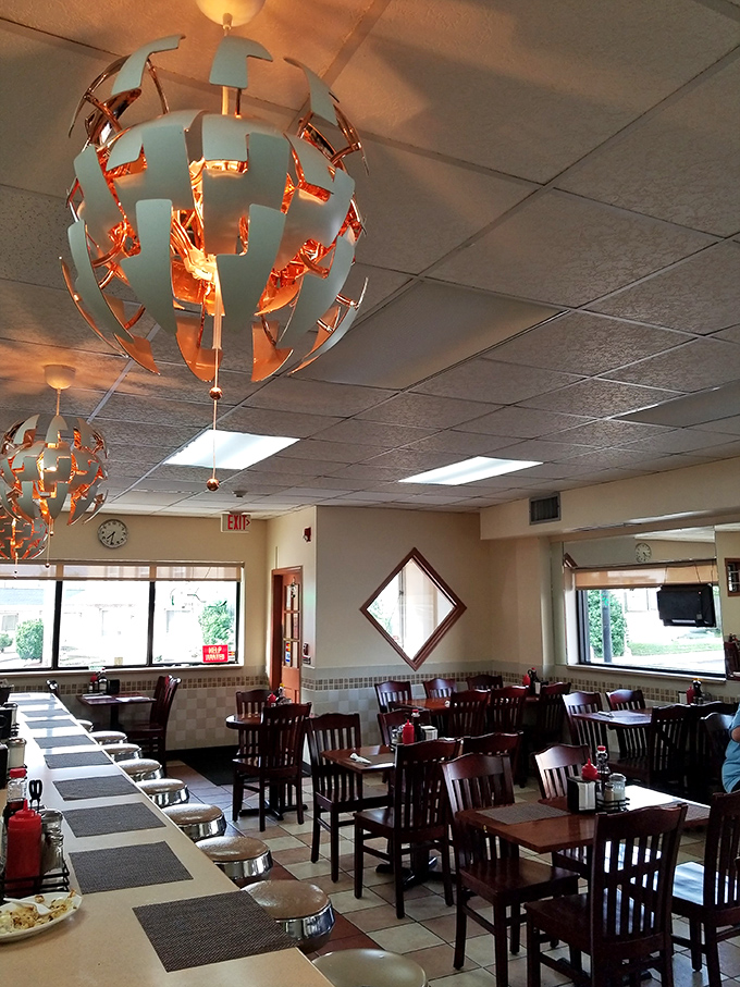 Those distinctive spherical light fixtures cast a warm glow over tables where breakfast dreams routinely come true.