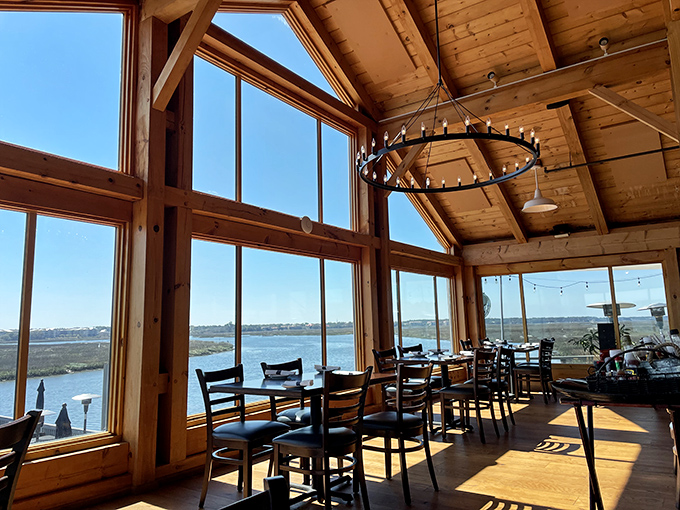Floor-to-ceiling windows frame the marshland views like living paintings, making even the most casual Tuesday dinner feel like a special occasion.