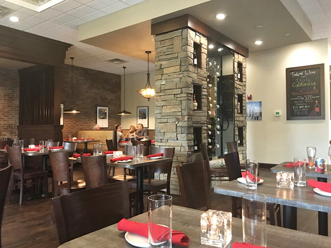 Stone accents and warm lighting create the rare restaurant magic where you can actually hear your dinner companions without reading lips.