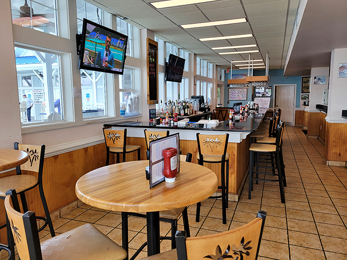 The bar area invites lingering conversations and impromptu friendships &ndash; where strangers become dining companions over shared appetizers.