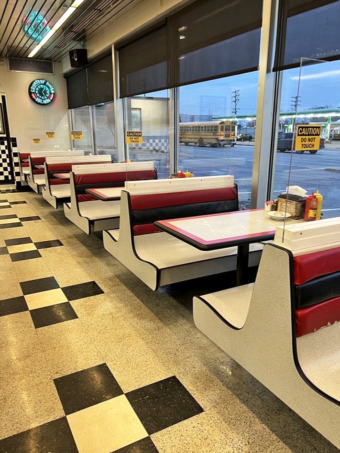 The booths along the window offer front-row seats to the world outside while you enjoy the timeless performance happening on your plate.