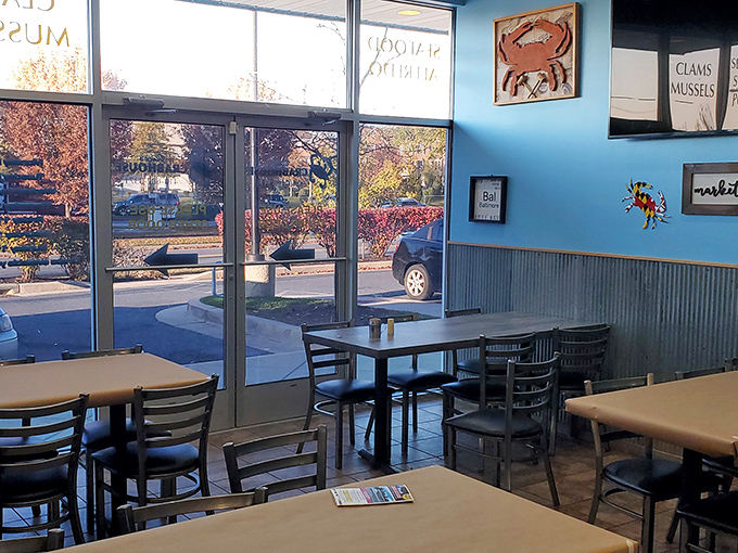 Maritime memorabilia adorns the walls while diners plot their next crab-cracking strategy at cozy tables.