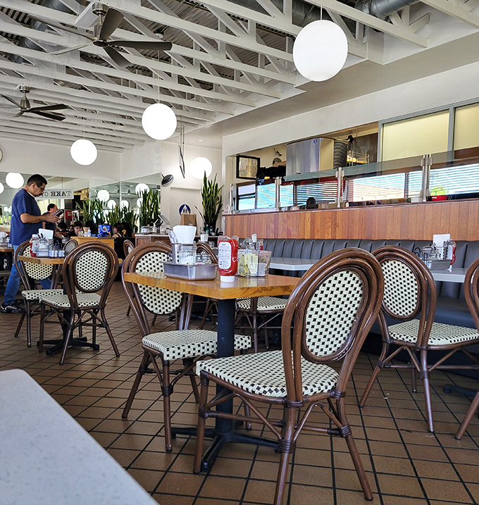 Bistro chairs and wooden tables create that perfect "I've discovered something special" atmosphere that makes regulars out of first-timers.