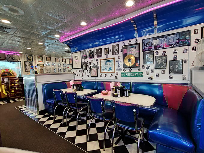 Elvis would approve of this booth&mdash;blue vinyl seating beneath walls plastered with vintage memorabilia and a street sign marking "PRESLEY RD."