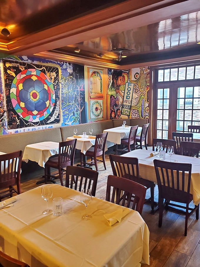 Every table tells a story beneath walls that could keep art lovers entertained through multiple courses and several desserts.