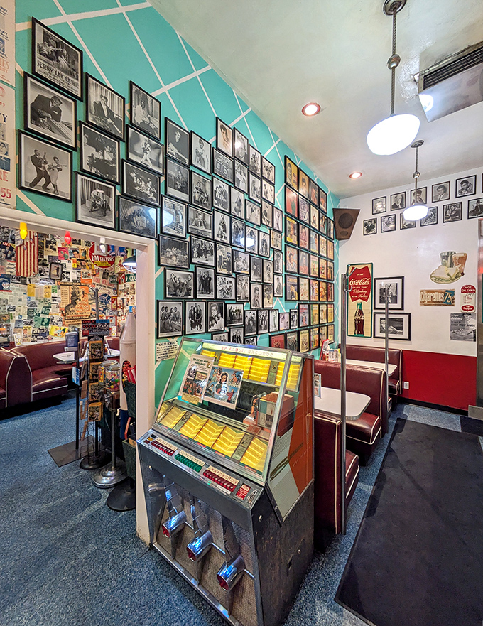 The jukebox stands sentinel among vintage booths, ready to provide the soundtrack for your meal. Elvis would feel right at home here.