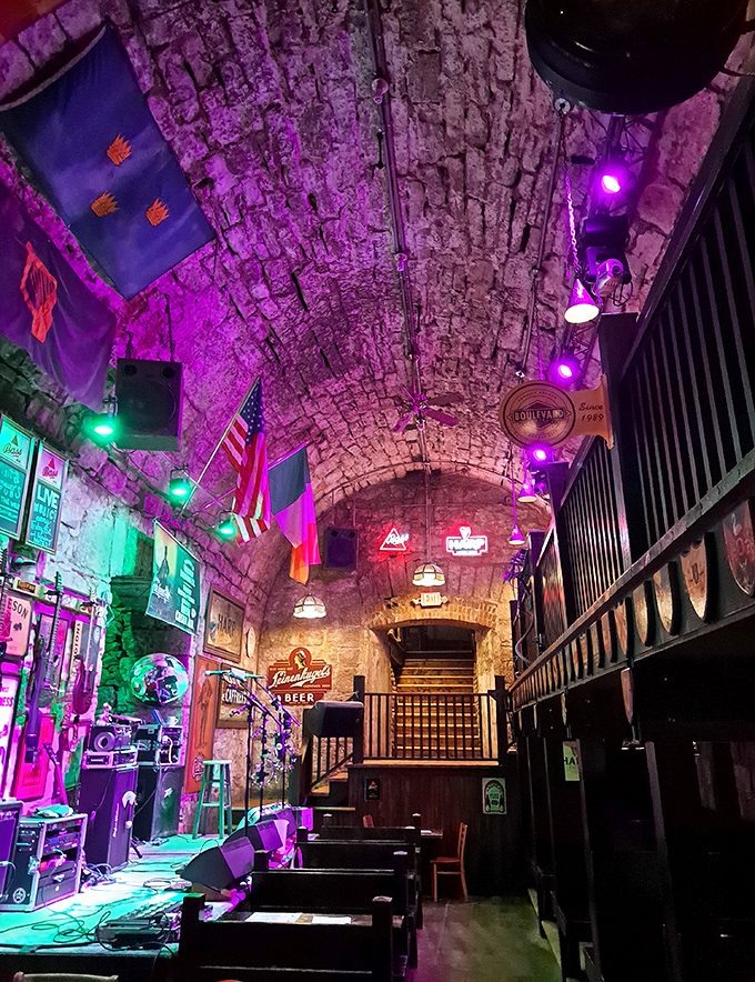 The stage is set for memories to be made. Purple and green lights transform ancient stone into a magical music venue.