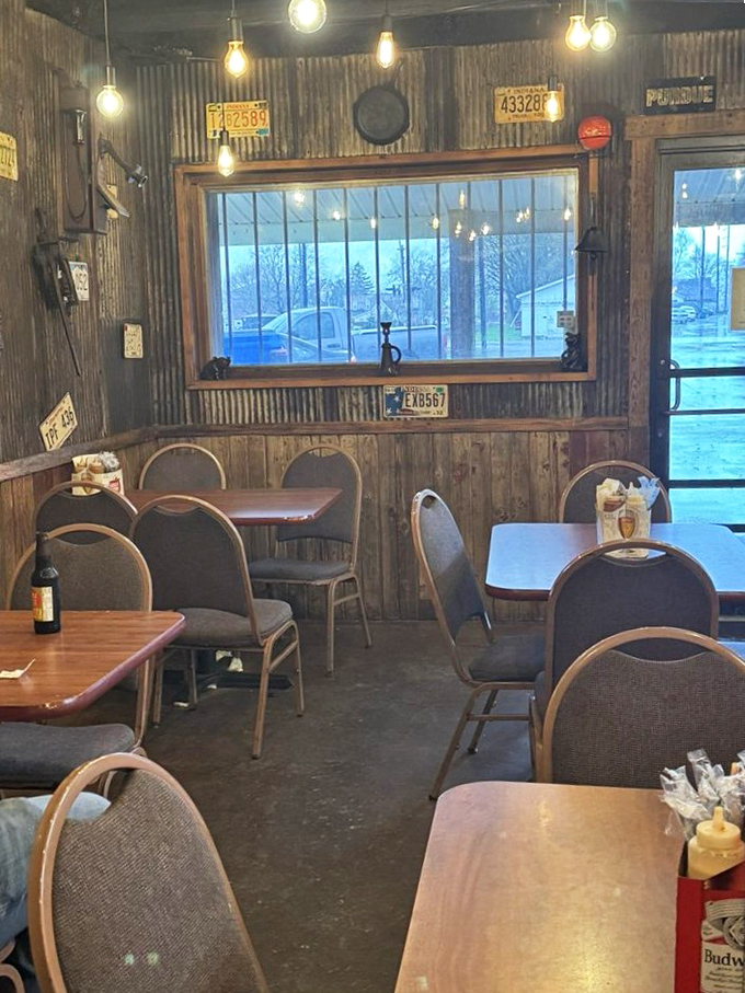 A dining room that says "focus on the food" without saying a word. Those license plates have seen more road trips than your average food critic.