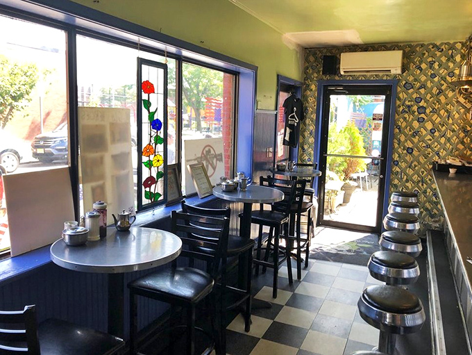 The dining room hums with conversation and contentment &ndash; black tables against cheerful walls create the perfect breakfast theater.