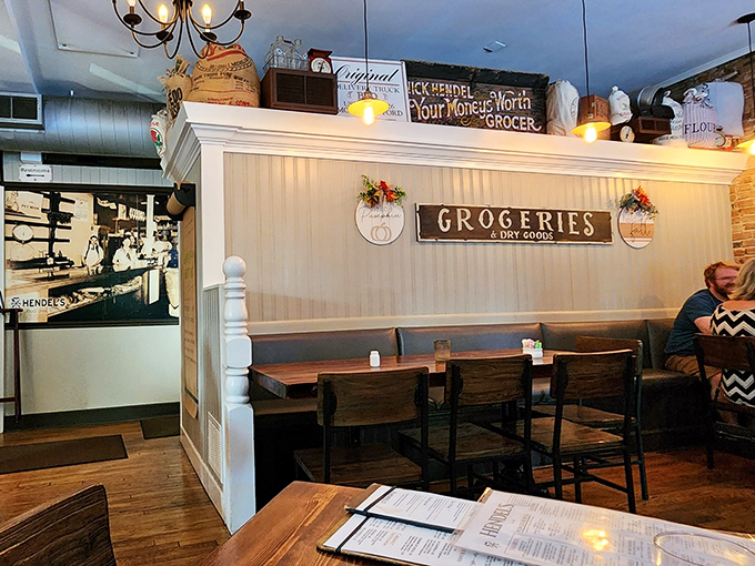 The "Groceries & Dry Goods" sign nods to the building's mercantile past, while wooden tables invite you to make some delicious history of your own.