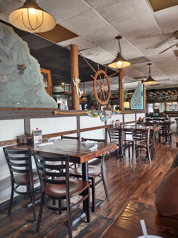 Maritime decor meets comfortable dining where ship wheels and rope details transport you to coastal paradise.