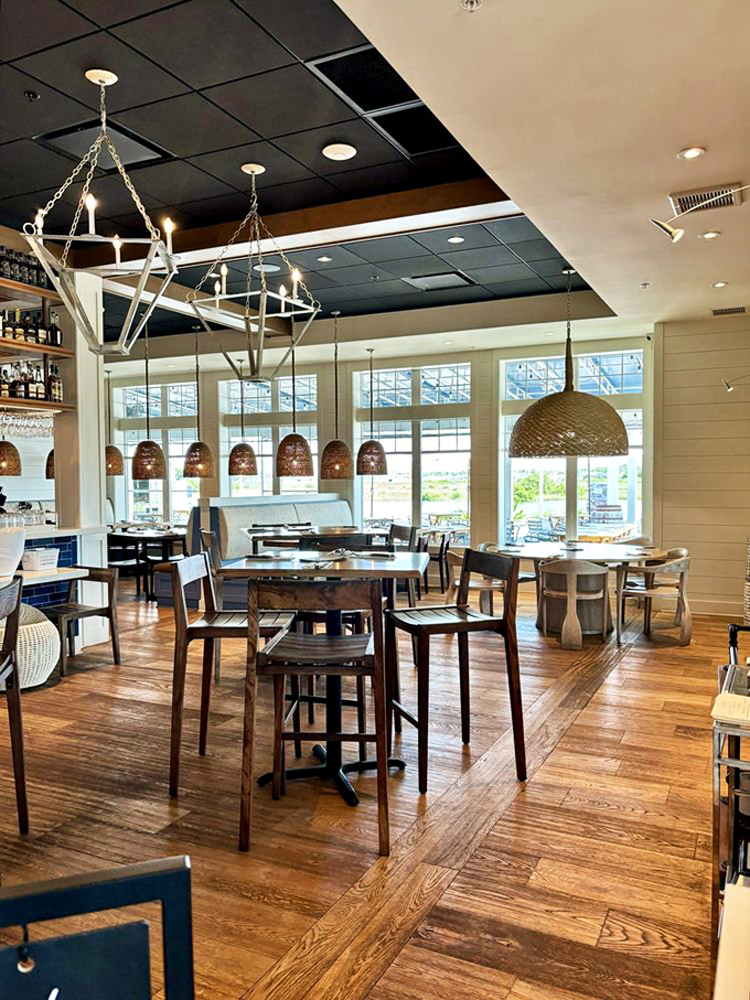 Woven pendant lights and warm wood create an atmosphere that whispers "stay awhile" in the most convincing way.