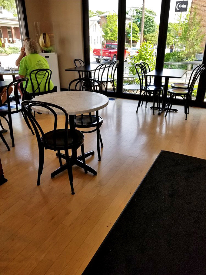 The caf&eacute;'s interior offers a front-row seat to pastry theater, where light wood floors and bistro chairs create the perfect backdrop for your sugar-induced euphoria.