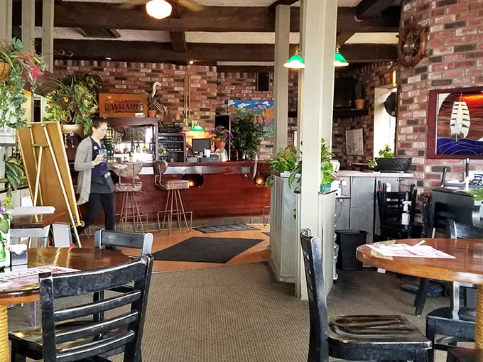 Exposed brick, wooden beams, and plants breathing life into every corner. This isn't just restaurant design—it's a master class in waterfront comfort.