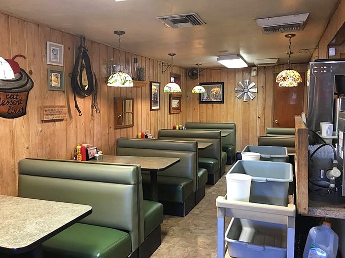 Green vinyl booths and wood-paneled walls create the perfect backdrop for conversations that flow as freely as the coffee refills.